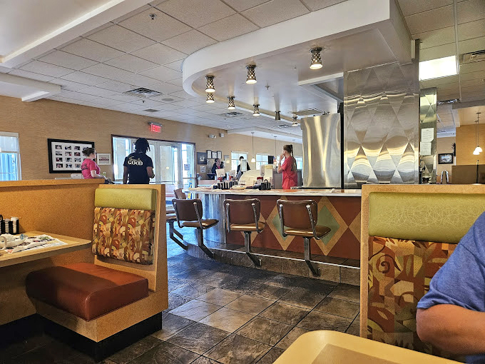 Classic diner geometry at its finest&mdash;where counter seating meets cozy booths, and the gentle hum of conversation blends with the sizzle from the kitchen.