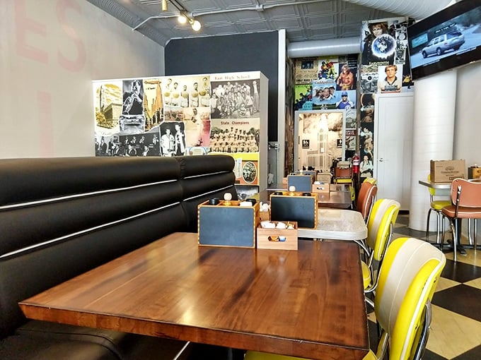 Cozy booths, vibrant yellow chairs, and walls plastered with memories create that perfect "third place" between home and work where breakfast dreams come true.
