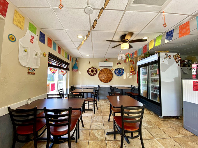 Simple tables, colorful papel picado, and that ceiling fan spinning stories of authentic Mexican cuisine. No designer needed when the food is this good.