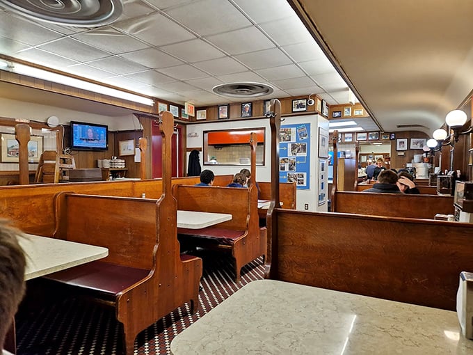 Wooden booths worn smooth by decades of satisfied customers tell stories no Instagram filter could capture. This isn't retro-inspired&mdash;it's the real deal.