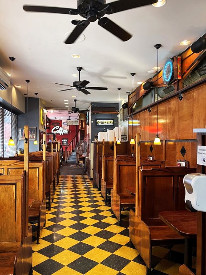 Classic wooden booths line a checkerboard floor that's seen decades of Richmond stories. This isn't manufactured nostalgia—it's the real deal.