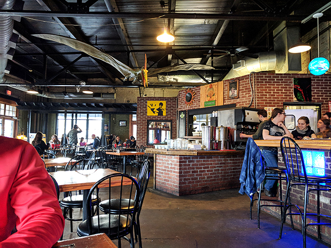 Inside, exposed brick walls and industrial ceilings create the perfect backdrop for cheese-induced euphoria.