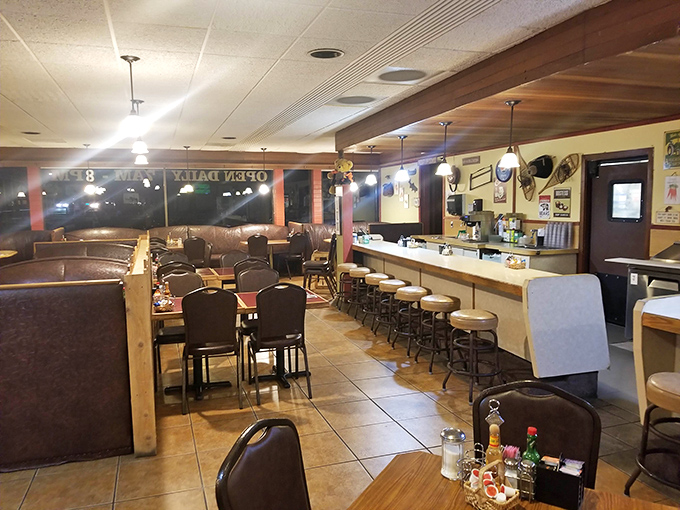 Classic diner booths where countless stories have been shared over coffee refills. The counter seats offer front-row tickets to the breakfast ballet.