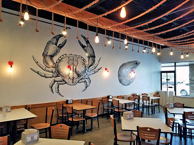 Nautical ropes and pendant lights dangle overhead while massive seafood illustrations stand guard. Like being in a stylish captain's quarters, minus the seasickness.