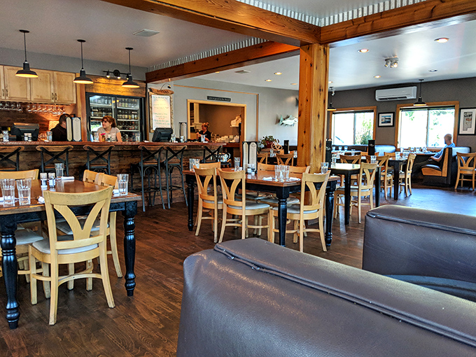 Warm wood tones, exposed beams, and casual elegance define the dining room &ndash; where coastal comfort meets culinary seriousness without a hint of pretension.