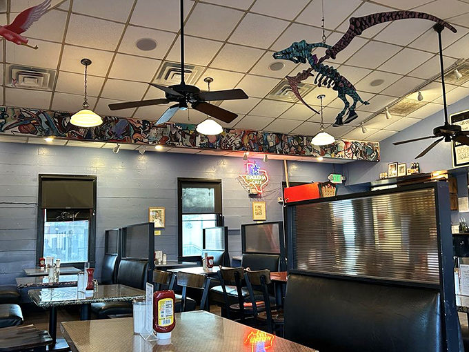 The classic black and white checkered floor plays visual ping-pong with vibrant red booths and sunny yellow tables&mdash;a color scheme that screams "happiness served here!"