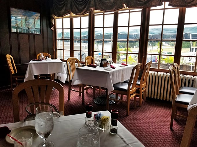 White tablecloths and panoramic windows create the perfect setting for savoring exceptional meals while watching boats drift lazily along the Northeast River.