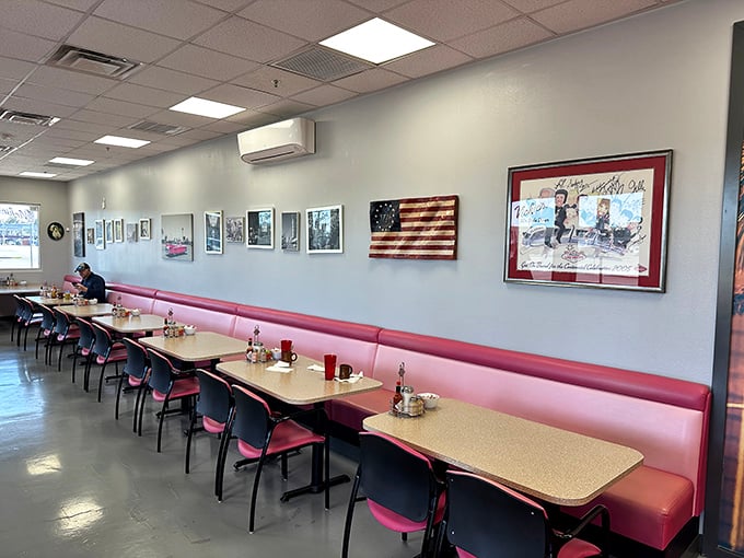 Classic diner aesthetics with those unmistakable pink booths&mdash;where conversations flow as freely as the coffee refills.