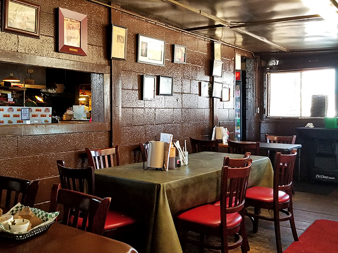 Inside Leo's, the walls tell stories of decades of barbecue excellence. Simple tables, red chairs, and the promise of meat magic await hungry pilgrims.