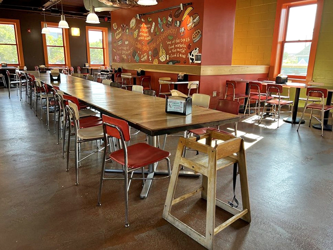 Communal tables bathed in natural light invite strangers to become friends over shared sandwich euphoria. The chalkboard menu whispers delicious possibilities.