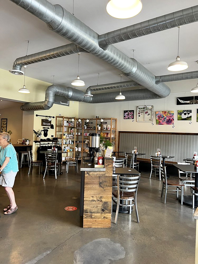 Industrial meets cozy in this thoughtfully designed space. The exposed ductwork overhead is like modern art for people who also appreciate a good egg.