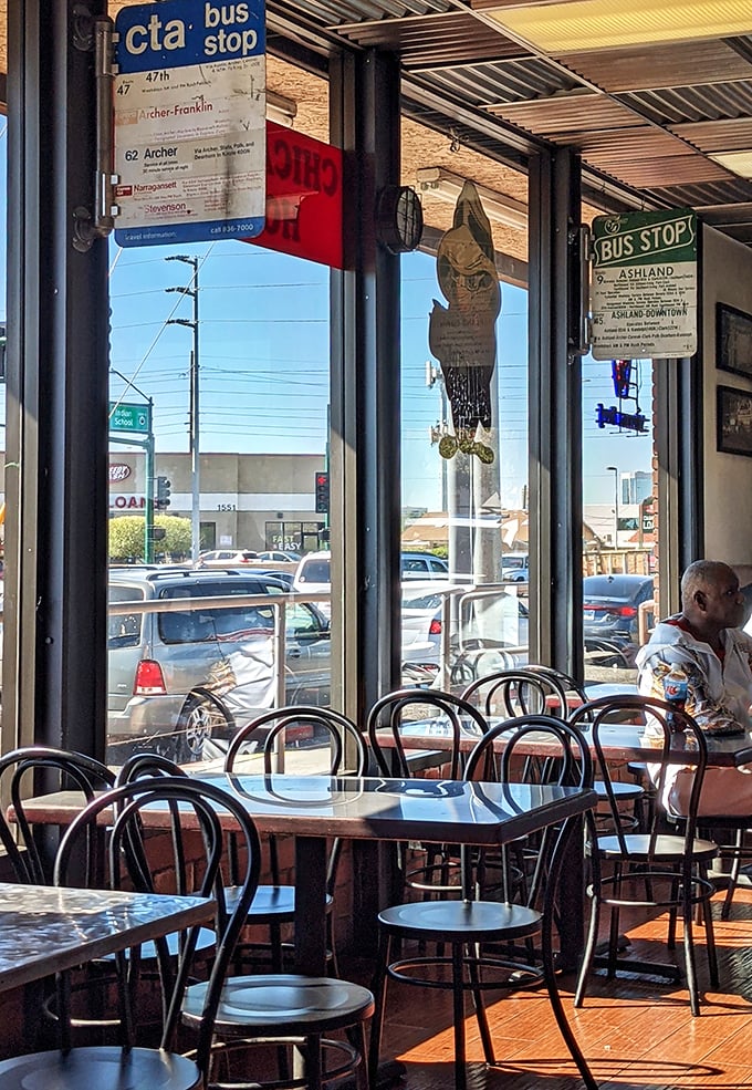 The CTA bus stop signs aren't just decor – they're a promise of authenticity that whispers, "You're about to take a flavor trip to Chicago."