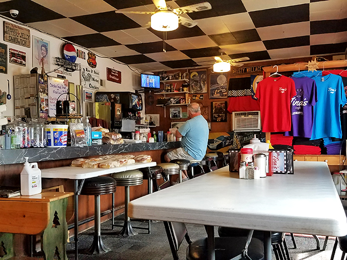 Inside, the black and white checkerboard ceiling continues the racing motif. It's like dining inside a cozy NASCAR museum where breakfast is always the main event.
