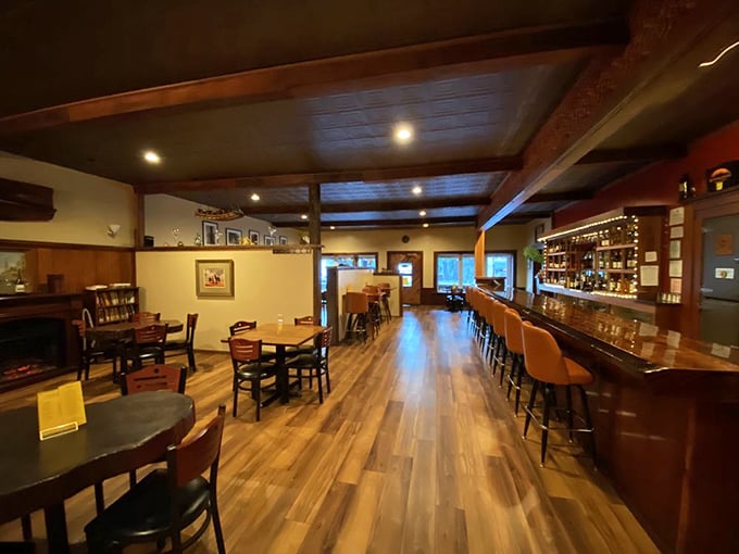 Step inside and exhale. This isn't just a dining room; it's a warm embrace of polished wood, soft lighting, and the promise of memorable meals.