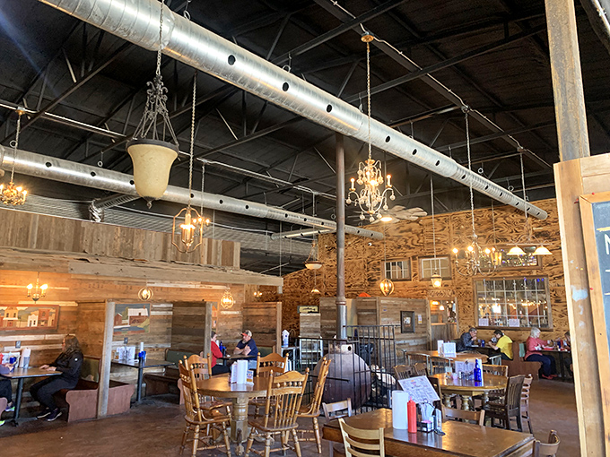 Rustic meets refined inside with exposed beams, wooden walls, and unexpected chandeliers&mdash;like a barn that went to finishing school.