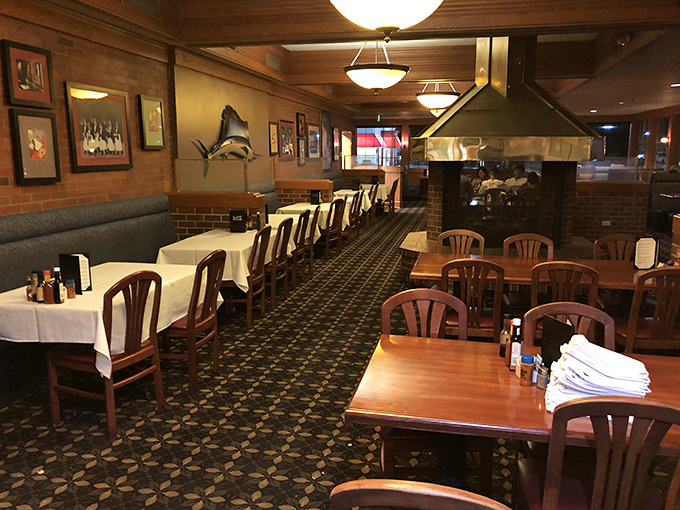 Classic steakhouse ambiance with white tablecloths and wood paneling &ndash; where time stands still but the service keeps moving.
