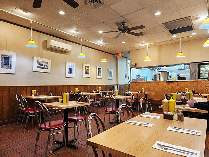 Wood paneling and yellow pendant lights create that perfect "your favorite aunt's dining room" vibe&mdash;comfortable, unpretentious, and ready for serious eating.