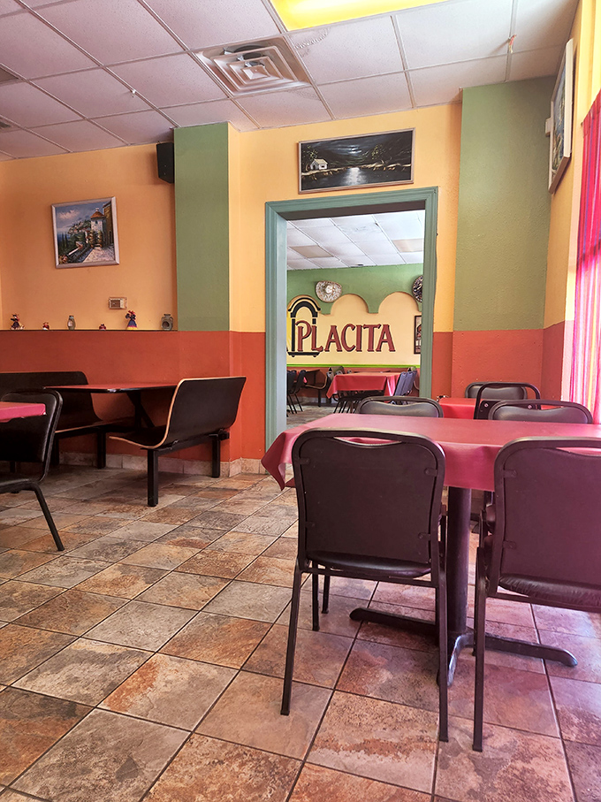 The dining room's color-blocked walls in warm oranges, greens, and reds create an atmosphere that's both festive and homey&mdash;Mexican comfort in Madison.