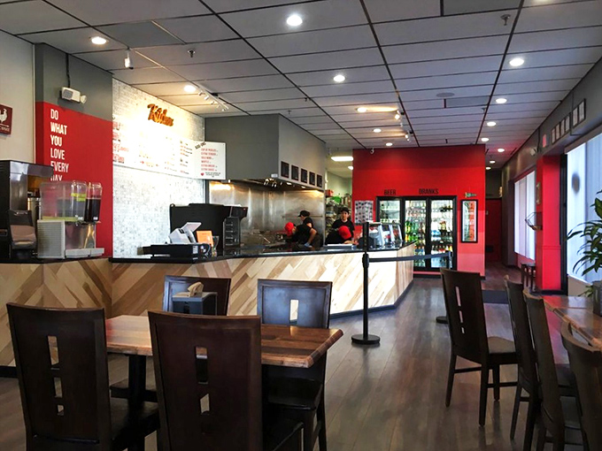 Modern minimalism meets Nashville tradition. The clean lines and vibrant red walls create the perfect backdrop for the flavor explosion to come.