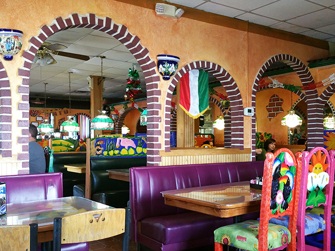 Step inside and you're transported south of the border, where colorful d&eacute;cor, brick archways, and those unmistakable purple booths create the perfect backdrop for flavor adventures.