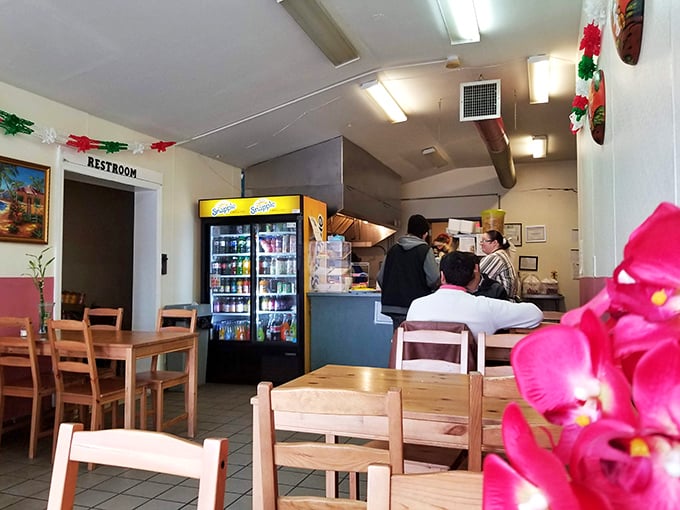 Simple wooden tables, a beverage cooler, and the promise of authentic flavors. This no-frills dining room lets the food do all the talking.