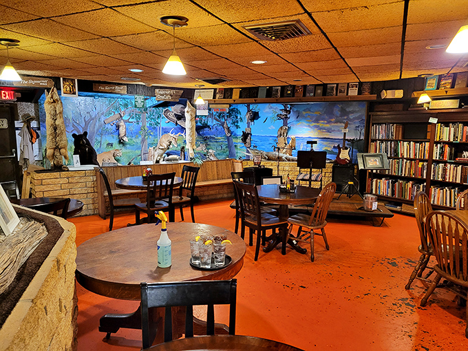 Where literature meets lunch. Bookshelves, wildlife murals, and that unmistakable orange floor create an atmosphere that's equal parts Hemingway and home cooking.