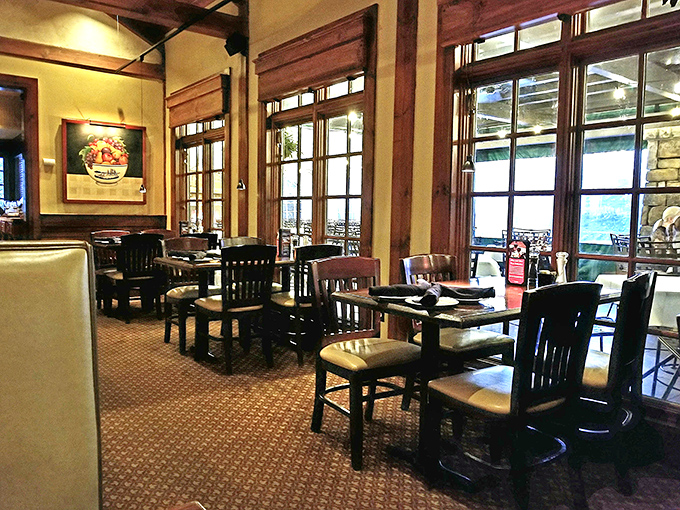 Polished wood, warm lighting, and those inviting mission-style windows create an atmosphere that feels like a sophisticated version of Grandma's dining room.