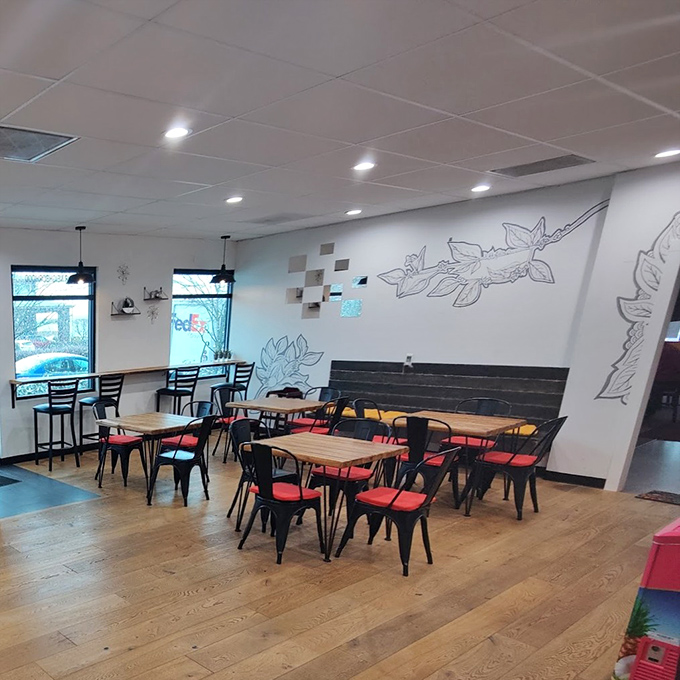 Clean lines, simple furnishings, and that minimalist leaf art on the wall &ndash; this isn't about fancy decor, it's about creating a distraction-free zone for serious burrito appreciation.