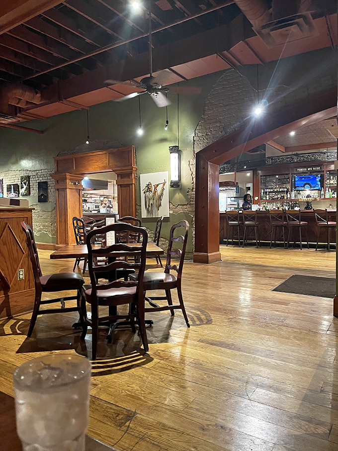 Step inside and the magic begins&mdash;exposed brick, warm wood tones, and that perfect lighting that says "stay awhile." The bar beckons from just beyond.