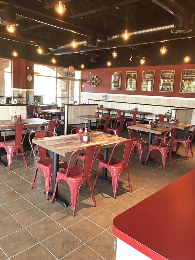 Industrial-chic meets seafood sanctuary with those eye-catching red chairs. Like a maritime version of the coolest classroom you never had.