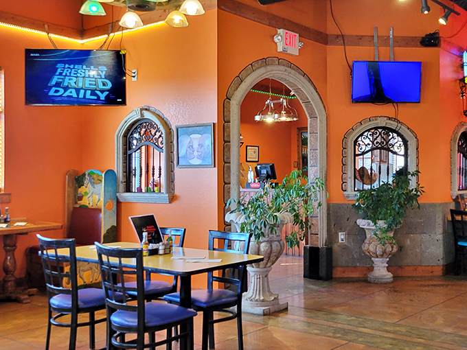Stone archways and vibrant orange walls create the perfect backdrop for what's about to become your new favorite Mexican escape in Ohio.