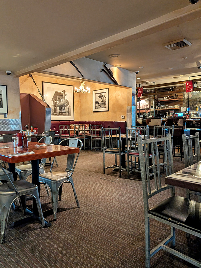 Industrial meets farmhouse in this cozy interior where vintage farm photos watch over diners about to embark on epic food adventures.