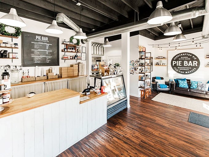 A cozy living room meets pie sanctuary, complete with that signature circular logo promising "handcrafted pie baked with care."
