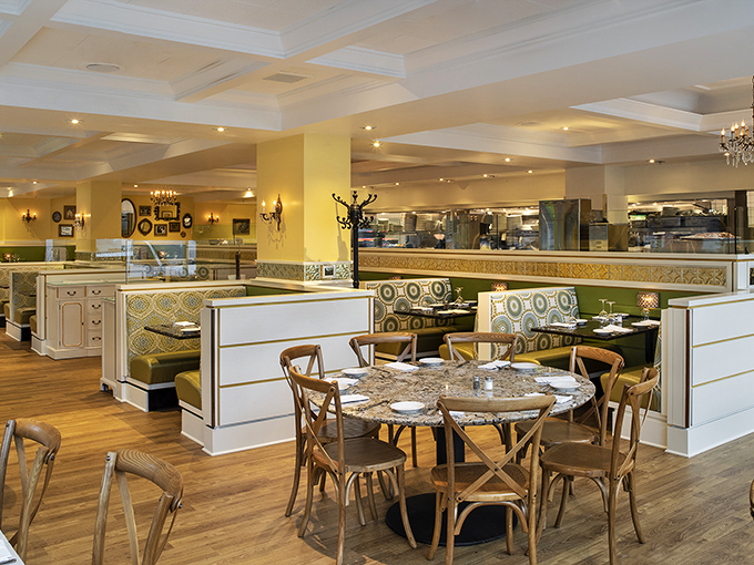 Chandeliers and marble tables create that rare alchemy of elegance and comfort—like wearing your favorite sweater to the opera.