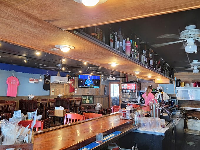 Inside Bernie's, wooden warmth meets coastal cool. The kind of place where strangers become friends over shared seafood recommendations.