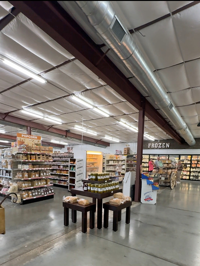 Fluorescent lights illuminate a treasure hunt through aisles of everyday necessities and local specialties, where culinary magic awaits in the back.
