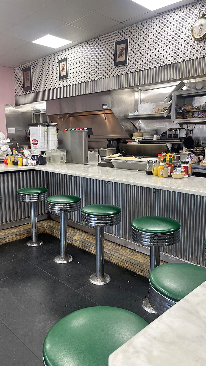 Those green vinyl stools aren't just seats&mdash;they're front-row tickets to the greatest food show in New Orleans, complete with spatula choreography.