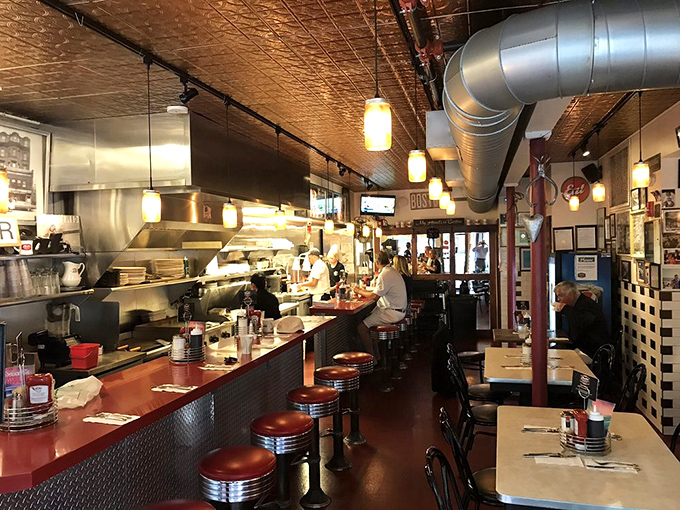 Classic diner perfection with vintage tin ceilings, counter seating, and walls that could tell a century of Boston stories.