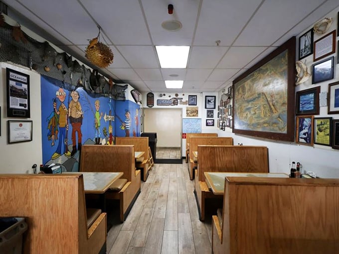 Wooden booths worn smooth from decades of happy diners frame walls adorned with maritime treasures and whimsical fishermen cartoons.