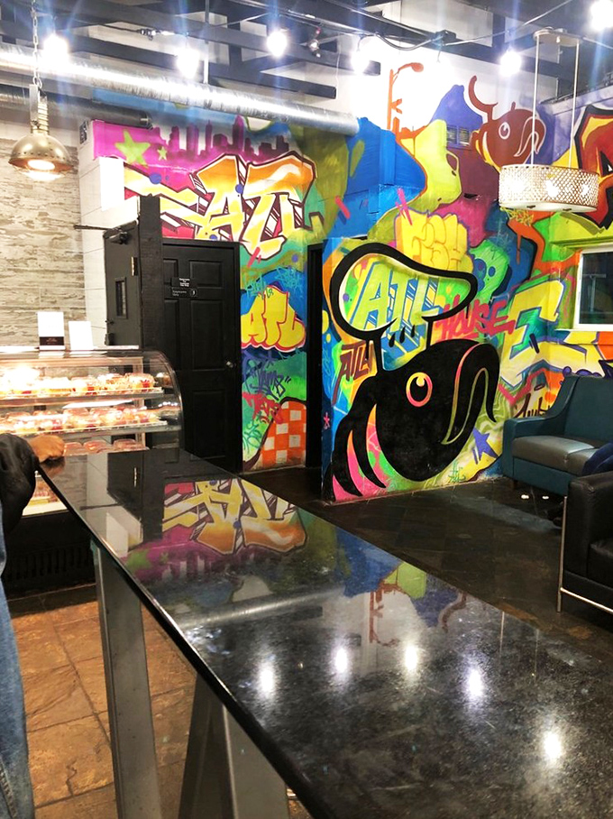 Graffiti meets gourmet in this vibrant interior where street art and seafood create an unexpected harmony. Atlanta's urban soul on full display.