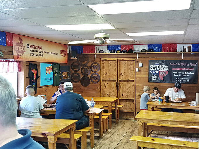 Simple, sturdy wooden tables where barbecue pilgrims gather to worship at the altar of smoked perfection.