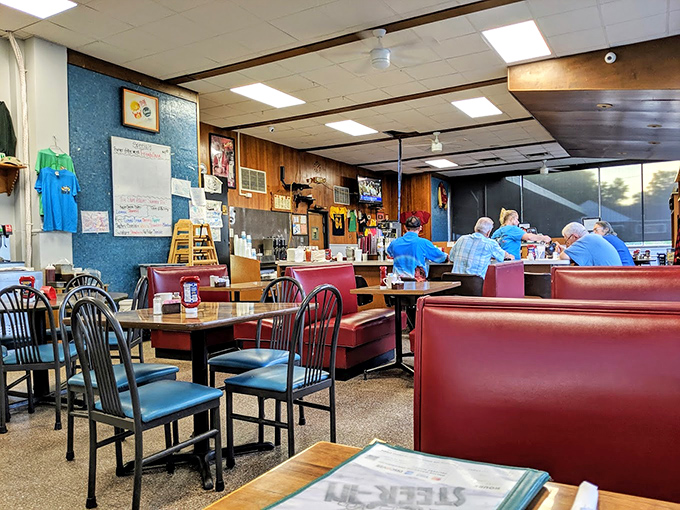 Red vinyl booths and wood-paneled walls tell stories six decades in the making. This isn't retro by design&mdash;it's authentic by survival.