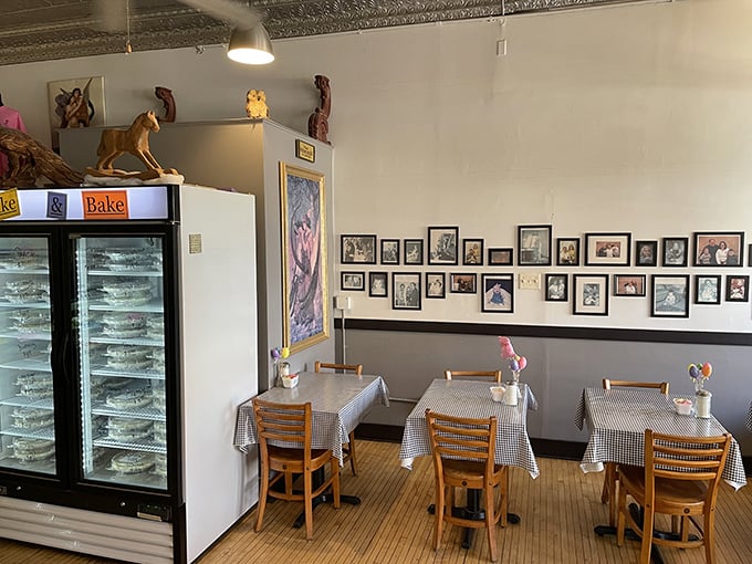 Simple wooden tables, checkered tablecloths, and a refrigerated case full of possibilities. This is where pie dreams come true.