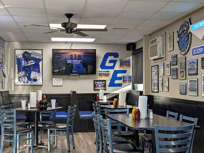 High school pride decorates every inch of wall space, transforming an ordinary dining room into a community hall of fame where memories are served alongside meals.