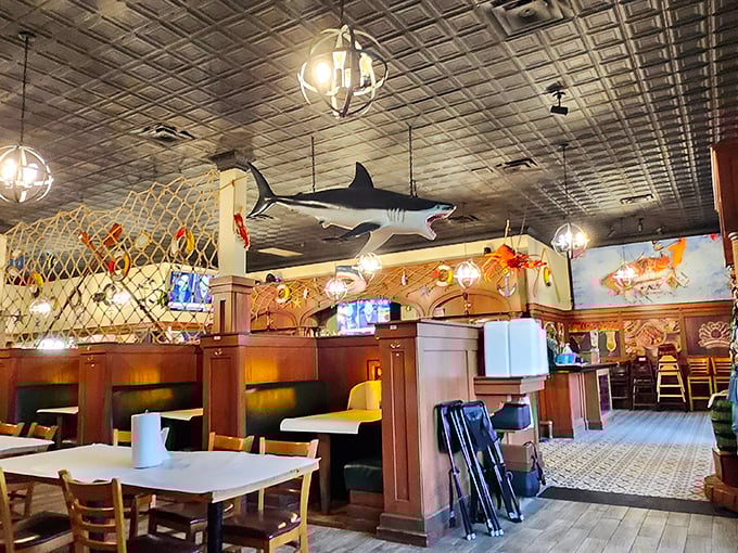 Beneath that watchful shark, diners plot their seafood strategy while the nautical decor whispers promises of coastal flavors in landlocked Kansas.