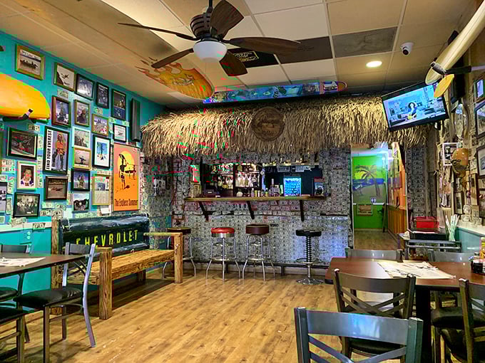 Tiki bar meets family diner in this delightfully eclectic interior. The turquoise walls and thatch-covered bar create a "vacation in your hometown" vibe.