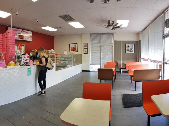 Retro orange chairs and no-nonsense decor – this is where donut dreams come true, not where interior designers come for inspiration.