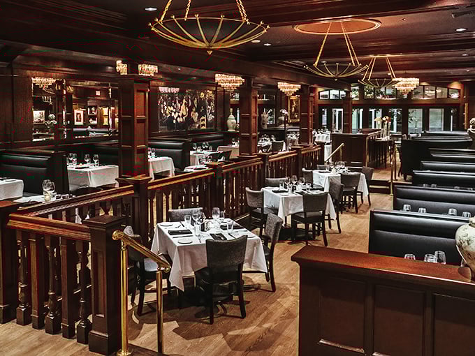 Dark wood, white tablecloths, and soft lighting create the quintessential steakhouse ambiance where memories are made and perfect steaks are savored.