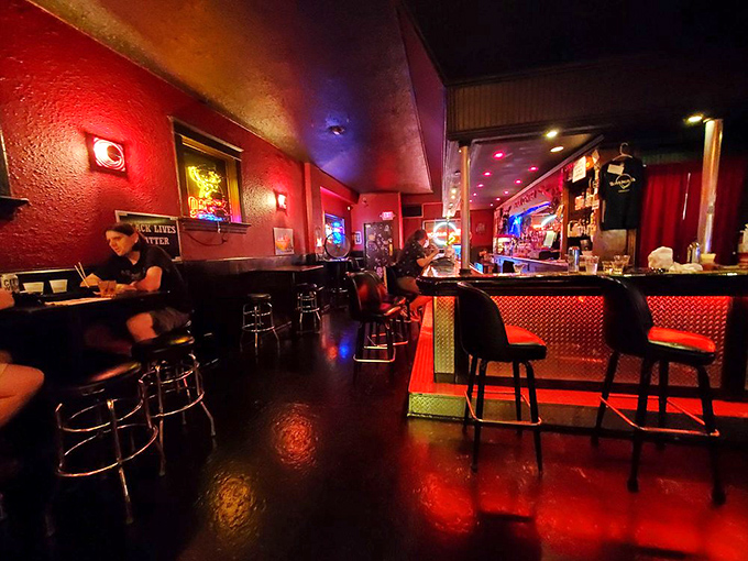 Where crimson walls meet the symphonic chaos of flippers and bells—this isn't just nostalgic entertainment, it's time travel with a beer chaser.