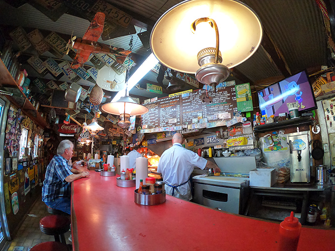 The classic red counter isn't just furniture - it's where strangers become neighbors and food becomes an experience.